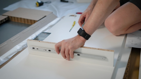 Shot of a Handyman Successfully Assembling New Table at Home., Stock ...