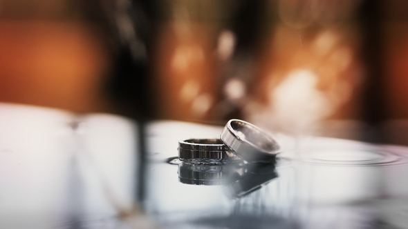 Two Wedding Rings in the Rain, Stock Footage | VideoHive