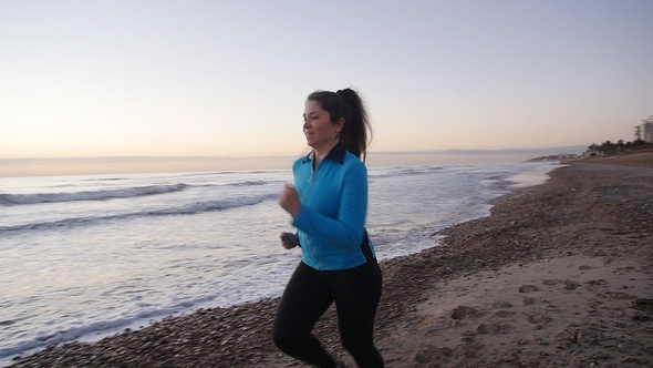 Fitness Woman Runner Running on the Beach, Stock Footage | VideoHive