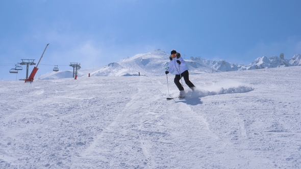 A Woman Skier Carving Go Down The Ski Slope Of The Mountain, Stock Footage