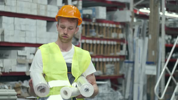Worker in Helmet Is Checking Materials at the Factory, Stock Footage