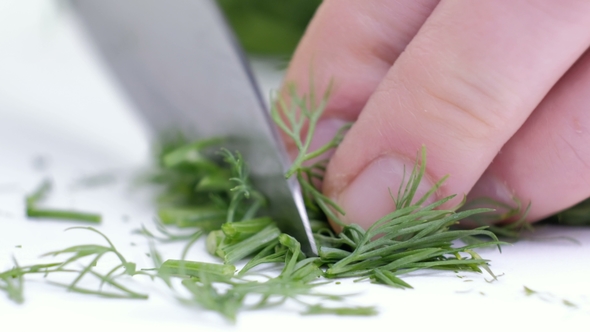 Cutting a Dill with a Knife. White Background, Stock Footage | VideoHive