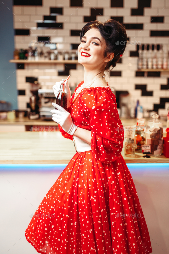 Pin up girl drinking popular carbonated drink Stock Photo by NomadSoul1