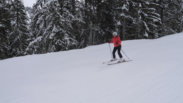 Beginner Skier Carefully Skiing Down The Slope On Skis In The Mountain ...