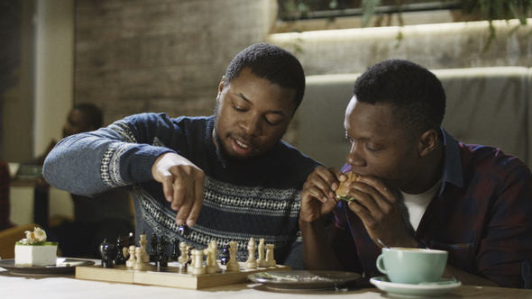 Content Black Men Playing Chess in Cafeteria, Stock Footage | VideoHive