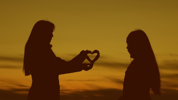 Children Share Heart with Each Other at Sunset of Golden Sun, Stock Footage