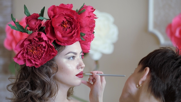 Makeup Artist Stylist Works with Model. Make-up of a Young Girl in a ...