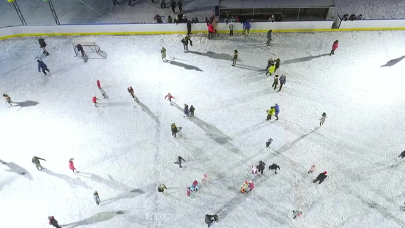 Aerial Shot Many People Skating on the Ice Rink, Stock Footage | VideoHive
