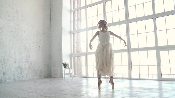 Ballet Dancer Dancing Classical Ballet. Young Ballerina in the Bright ...