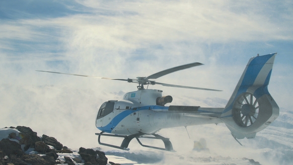 Heliskiing Helicopter Landed in the Snow Mountains, Raising a Big Cloud ...