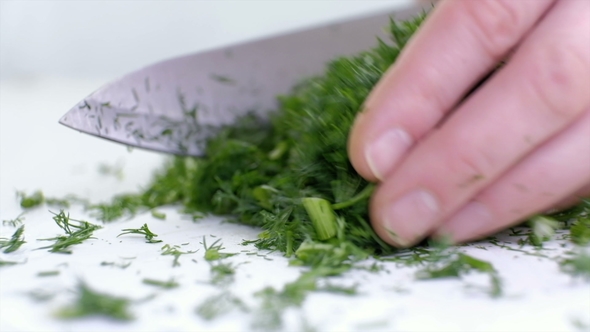 Fresh Dill on a Cutting Board, Knife and Bunches of Dill on a White ...