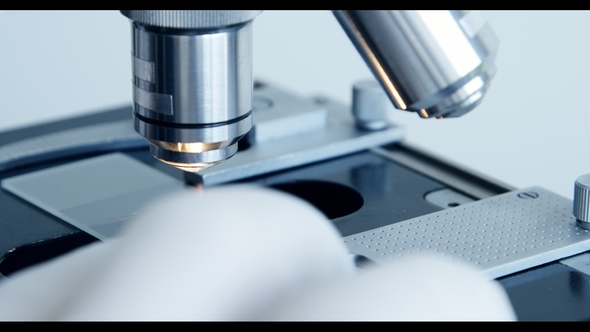 Examining of Test Sample Under the Microscope in Laboratory, Stock Footage