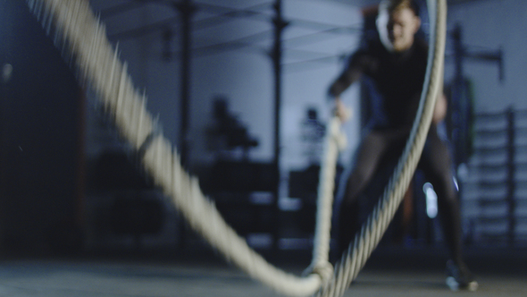 Powerful Sportsman Shaking Heavy Ropes Doing Exercise, Stock Footage