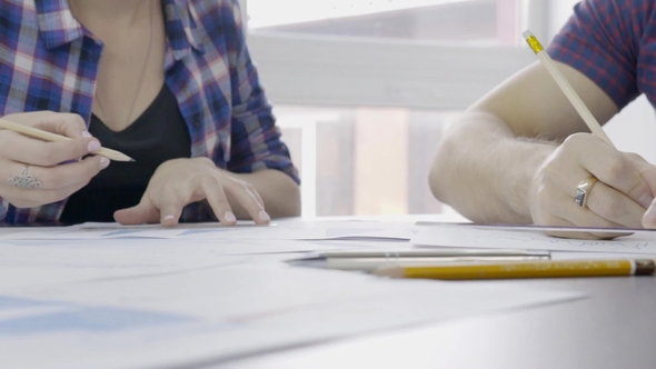 Two People Draw a Drawing on Ruler with a Pencil on the Desktop., Stock ...