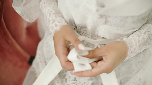 Hands Beautiful Girl in a White Robe Bow Ties, Stock Footage | VideoHive