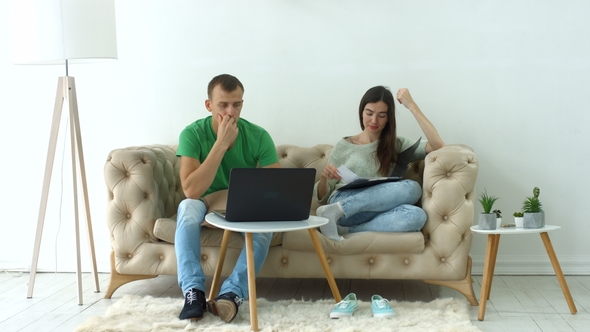 Worried Couple Doing Their Finances with Laptop, Stock Footage | VideoHive