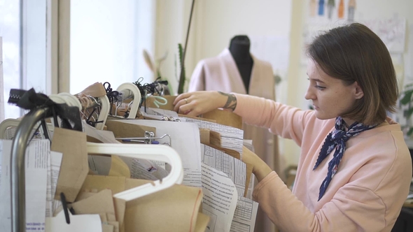 Portrait of Young Female Designer, Who Is Choosing the Curves for Dress ...