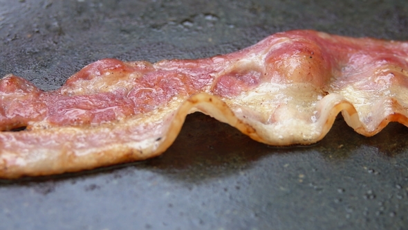 Slice of Bacon Roasted on a Stone Grill, Stock Footage | VideoHive