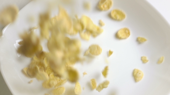 Corn Flakes Fall on White Dish, Stock Footage | VideoHive