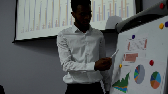 African American Coach Gives Corporate Presentation for Businesspeople ...