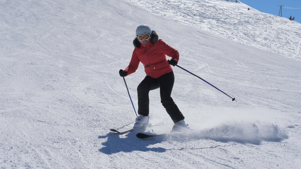 Elegant Woman Alpine Skier Professionally Carving Down The Slope In ...