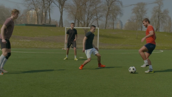 Football Players Training on Soccer Field in Spring, Stock Footage