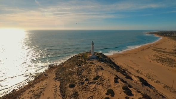 Aerial View of Lighthouse on the Coast during Sunset , Stock Footage