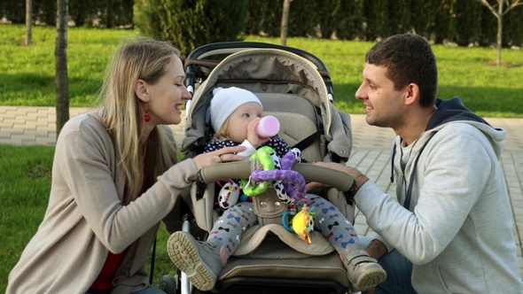 Happy Young Family and Little Baby in a Stroller., Stock Footage ...