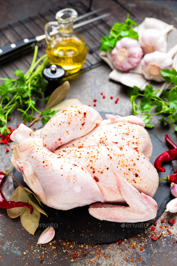 Raw chicken. Fresh whole chicken with ingredients for cooking Stock ...