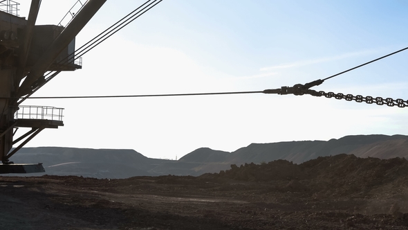 Dragline Excavator Loads Ore. The Ore Is Poured Out of the Bucket ...
