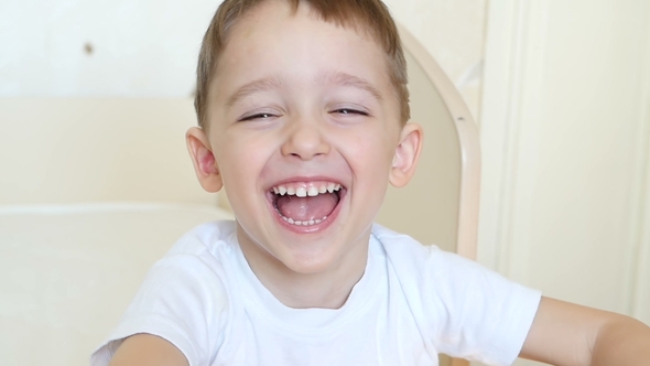 of a Child Looking and Smiling at the Camera in . The Child Shows Joy ...