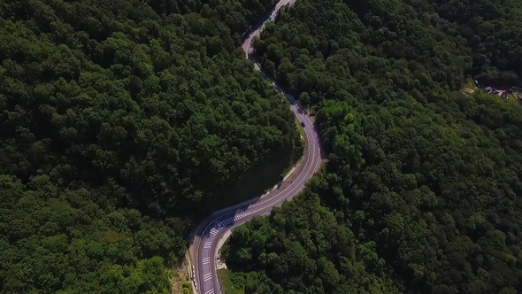 Aerial View Flying Over Old Patched Two Lane Forest Road with Cars Van ...