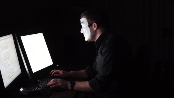 The Hacker in the Mask Hacks the Program, Stock Footage | VideoHive