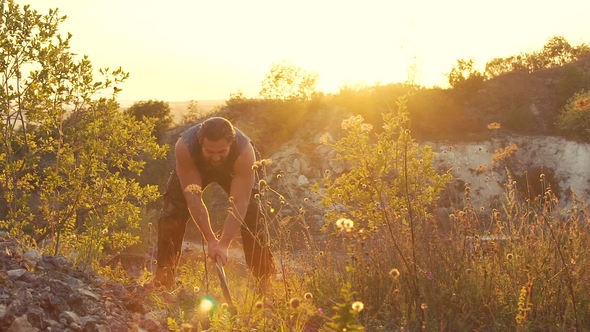 The Brutal Man Beating the Stone with Hammer on the Rock. Slowly, Stock ...