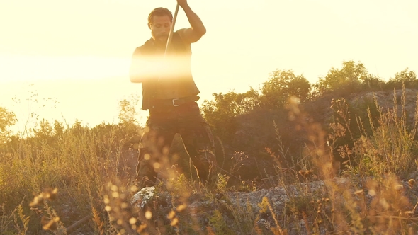The Brutal Man Beating the Stone with Hammer on the Rock. Slowly, Stock ...