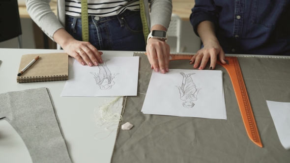 Designers' Hands Choosing Sketches for New Clothing Collection, Stock ...