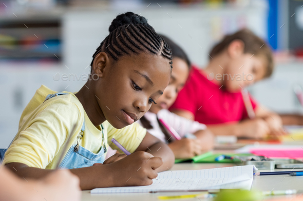 School girl writing in class Stock Photo by Rido81 | PhotoDune