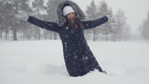 Young Woman Falling in a Snowdrift, Stock Footage | VideoHive