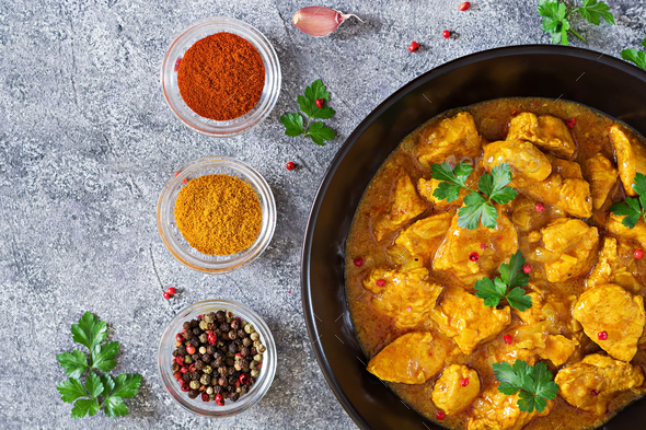 Curry with chicken and onions. Indian food. Asian cuisine. Top view ...