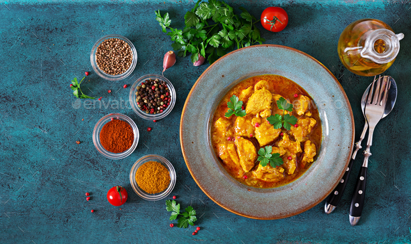 Curry with chicken and onions. Indian food. Asian cuisine. Top view ...