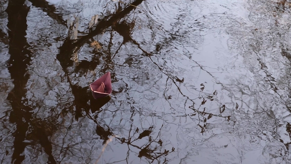 Brown Paper Boat Flows on the Water, Stock Footage | VideoHive