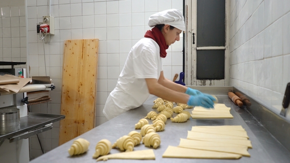 Traditional Italian Bakery. A Female Baker Turns Beautiful Croissants ...