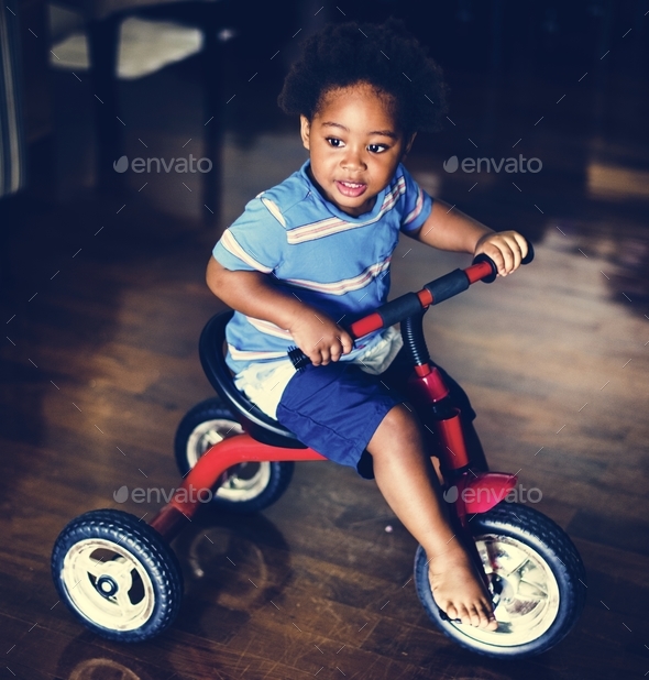Black kid riding bicycle in the house Stock Photo by Rawpixel | PhotoDune