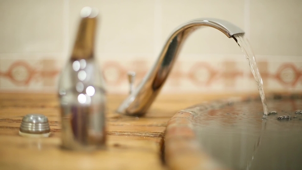 Water Stream Flows from the Water Tap into the Tub, Stock Footage ...