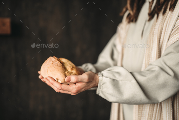 Jesus Christ with bread in hands, sacred food Stock Photo by NomadSoul1