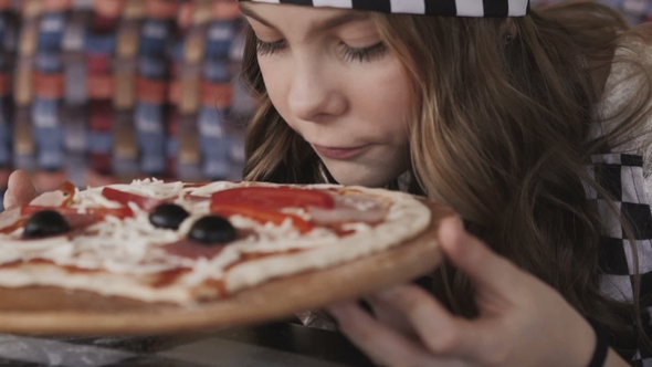Pretty Young Girl Enjoying the Smell of a Pizza. Slowly, Stock Footage