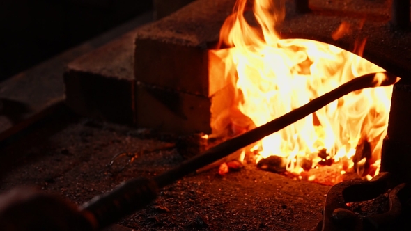 Blacksmith Fanning the Flames of the Furnace Using the Tools Prevents ...