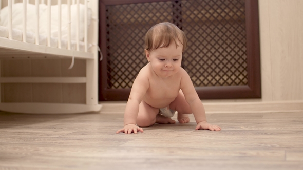 Happy Child Learns To Crawl on Floor in the Childrens Room, Stock Footage