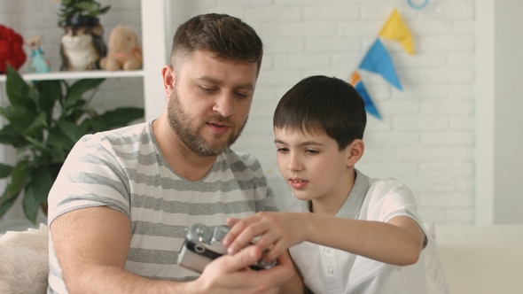 Dad Shows His Son How the Camera Works, Stock Footage | VideoHive