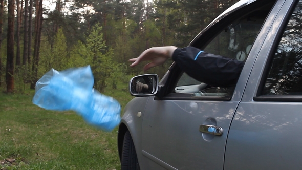 Man Throws the Garbage out of the Car Outdoors, Stock Footage | VideoHive